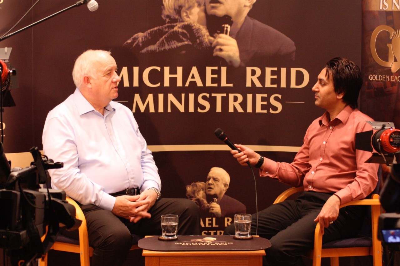 Who is Bishop Michael Reid?